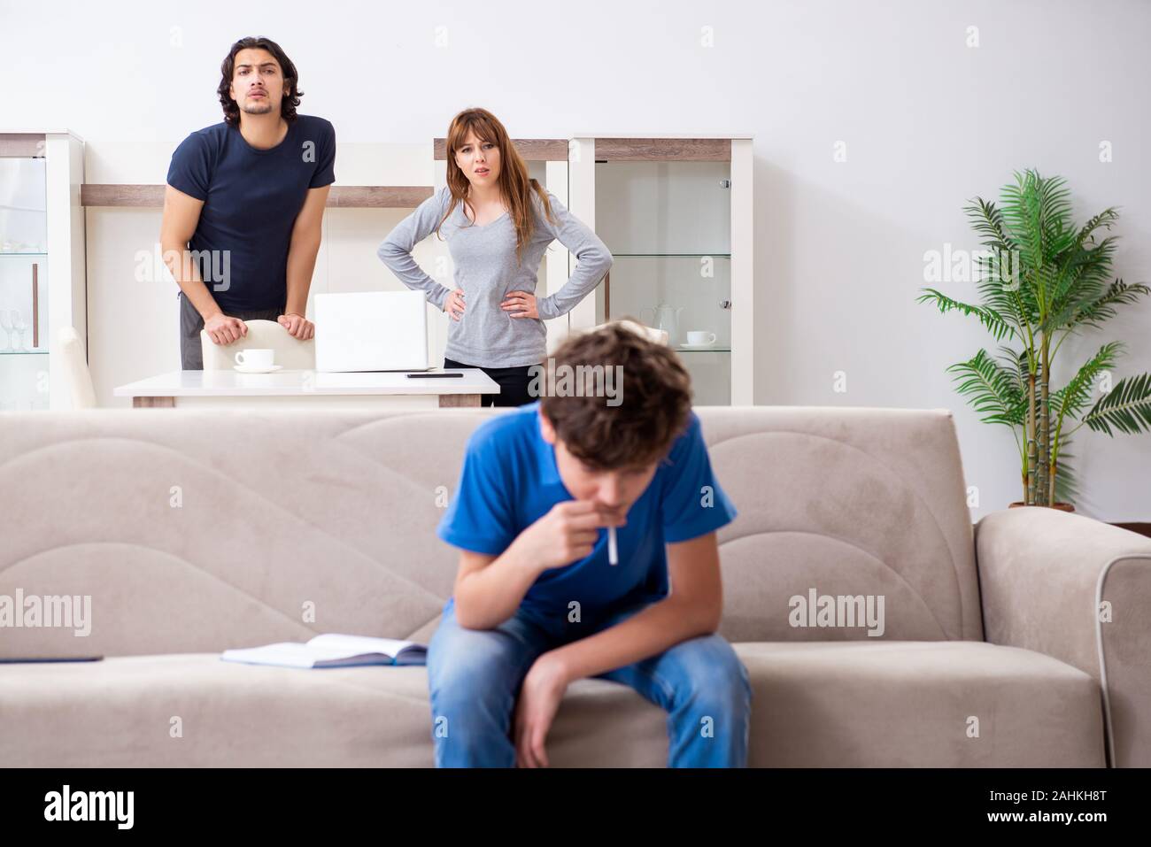 The concept of underage smoking with young boy and family Stock Photo ...
