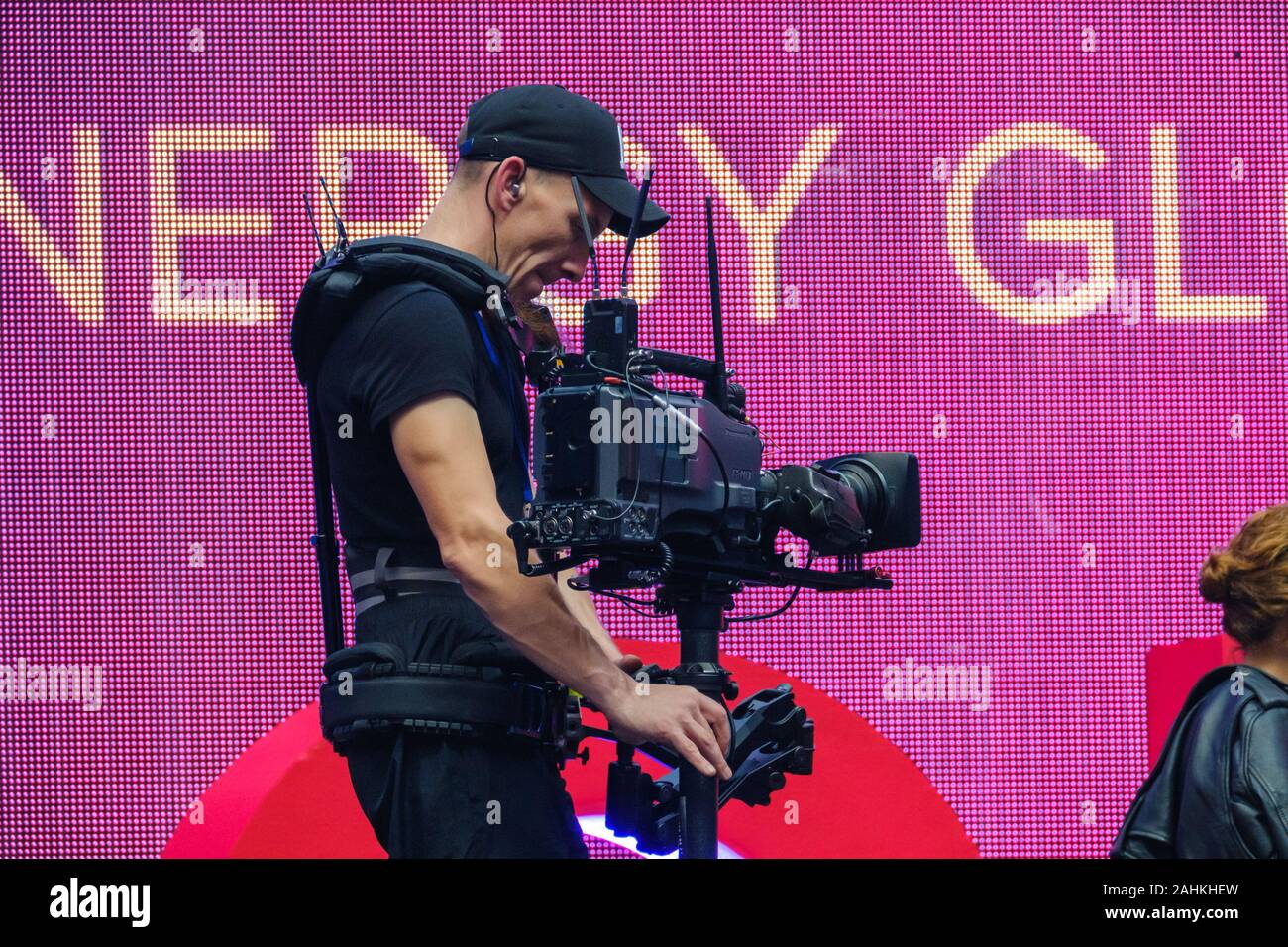 Steadicam camera man online broadcasting from stage Stock Photo - Alamy