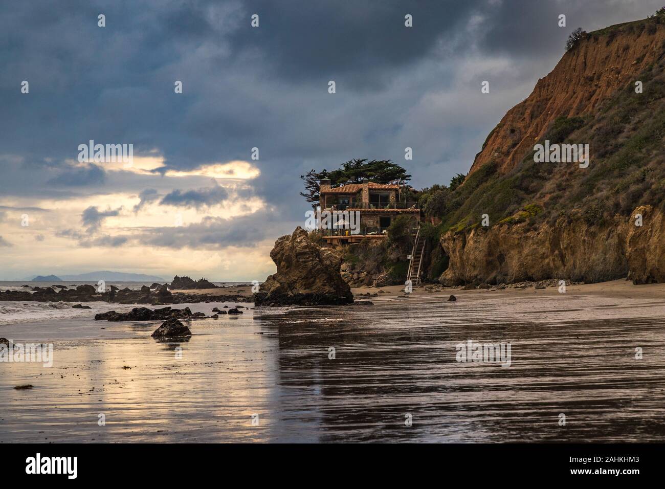 Coastline view of tall bluffs along El Matador Beach with reflections ...