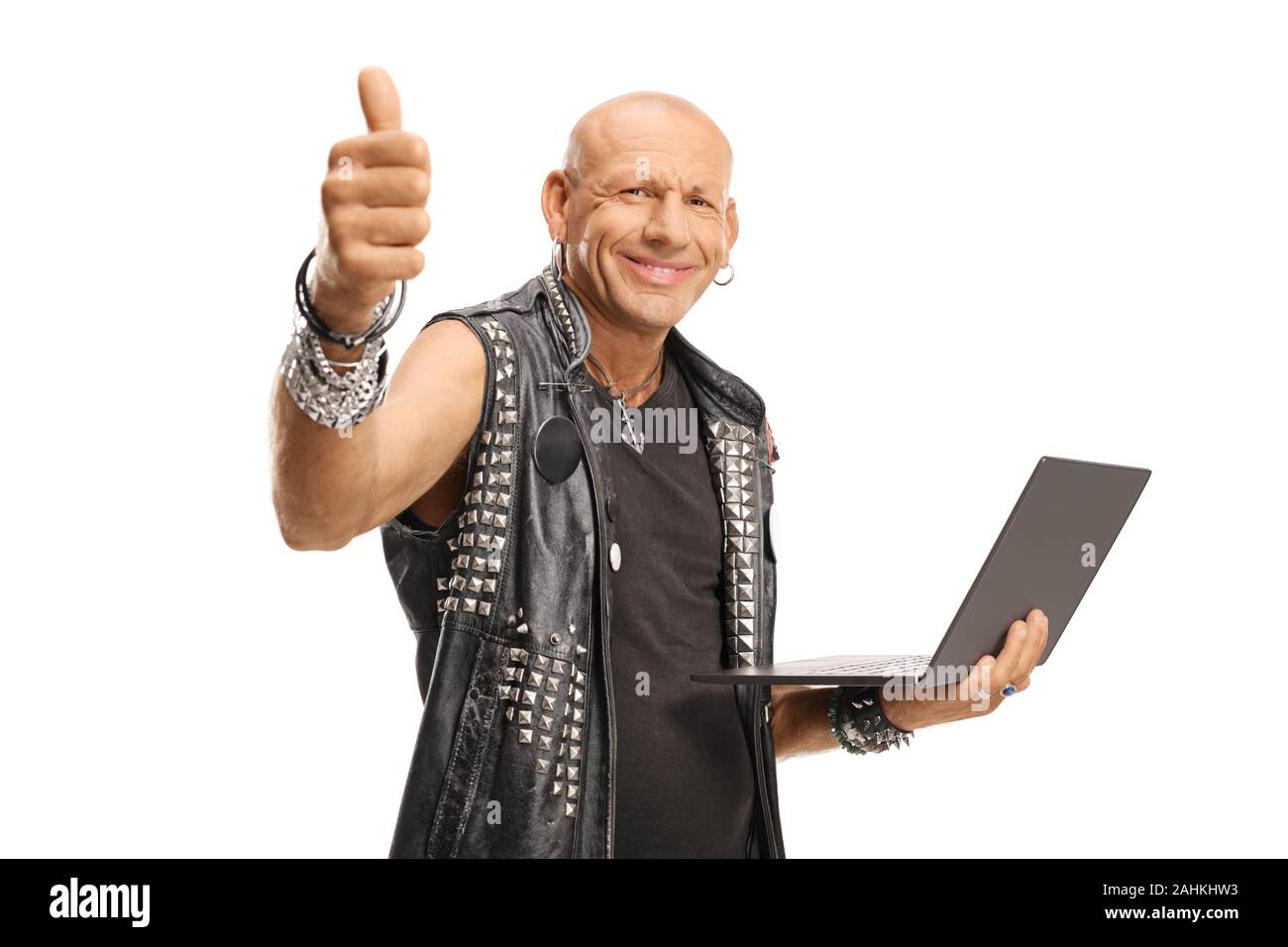 Punker with a laptop computer showing a thumb up isolated on white ...