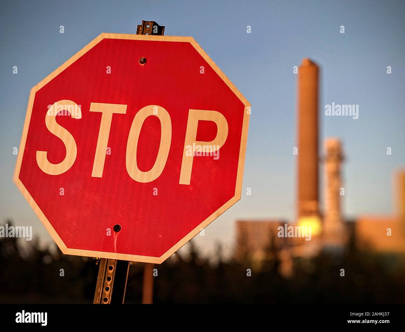 Stop Sign in Front of a Power Plant Stock Photo - Alamy