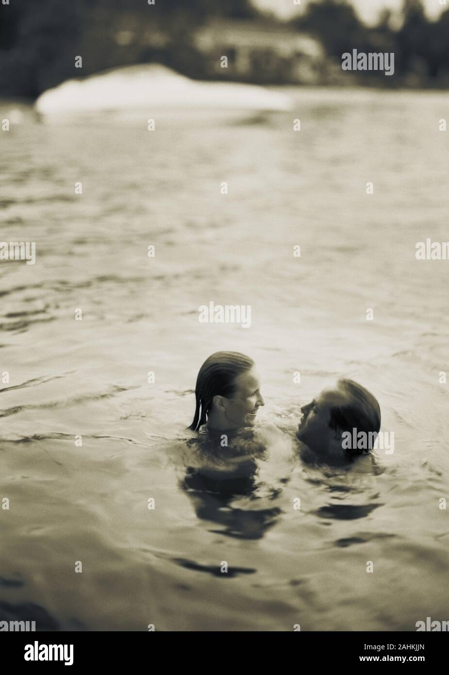 A couple is bathing in the sea Stock Photo - Alamy