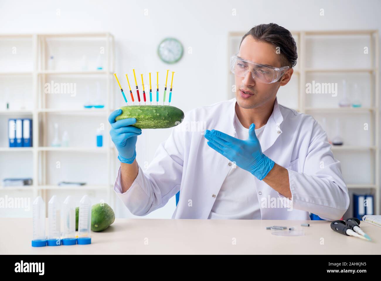 The male nutrition expert testing vegetables in lab Stock Photo - Alamy