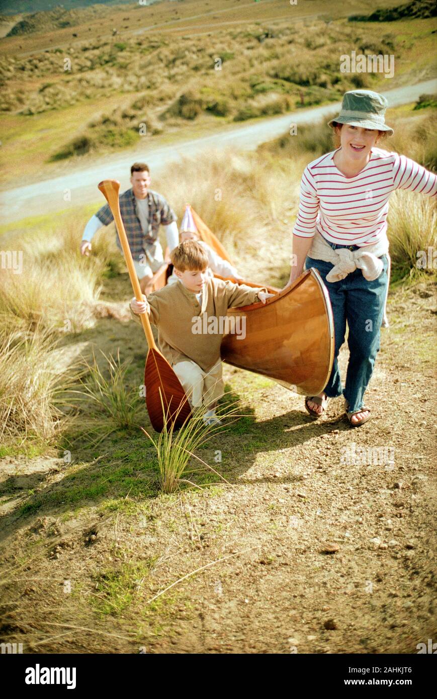 Carrying canoe together hi-res stock photography and images - Alamy