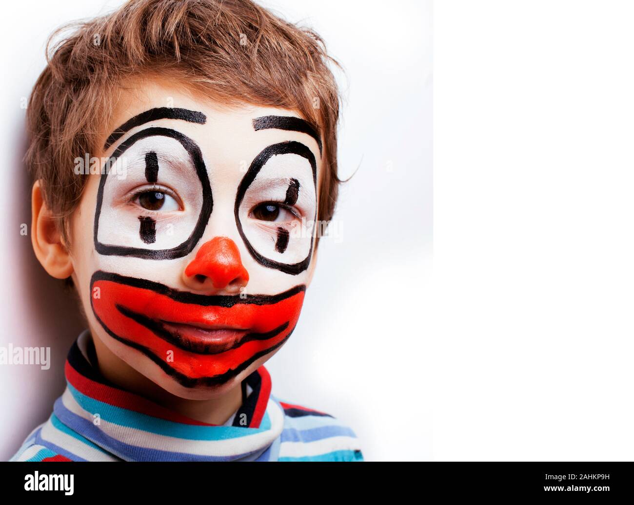 little cute boy with facepaint like clown, pantomimic expressions close ...