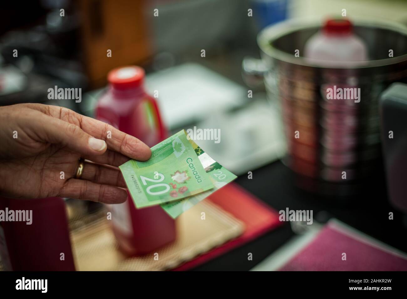 Female cashier giving money hi-res stock photography and images - Alamy