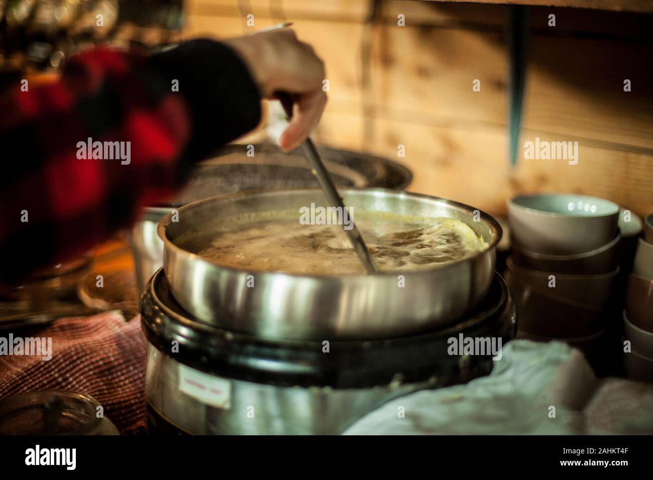 One person cooking in big pot hi-res stock photography and images - Alamy