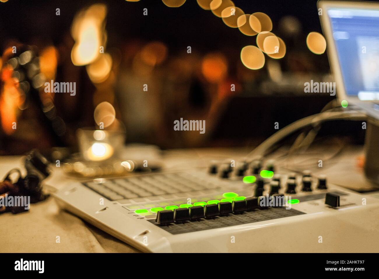 Musical instrument control panel with buttons and sliders and a laptop ...