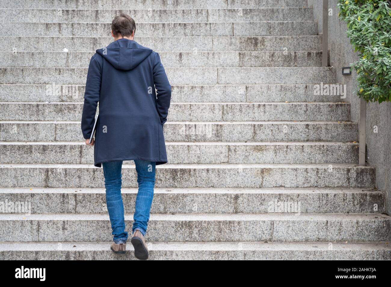 Professional man walking laptop computer hi-res stock photography and ...