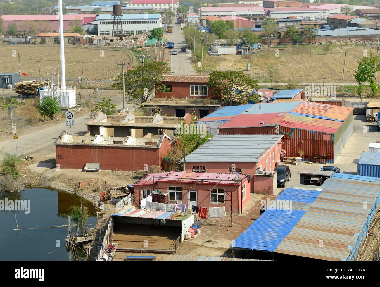 Cluster of small buildings on a smallholding between Tianjin city area ...