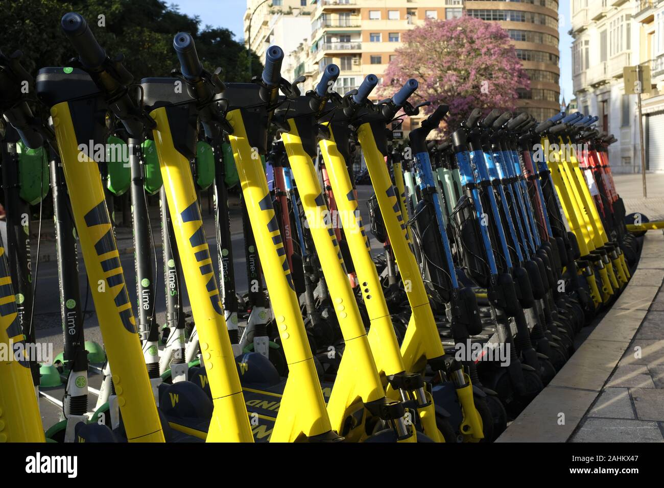 Mulitple electric scooters in Malaga, Spain Stock Photo - Alamy