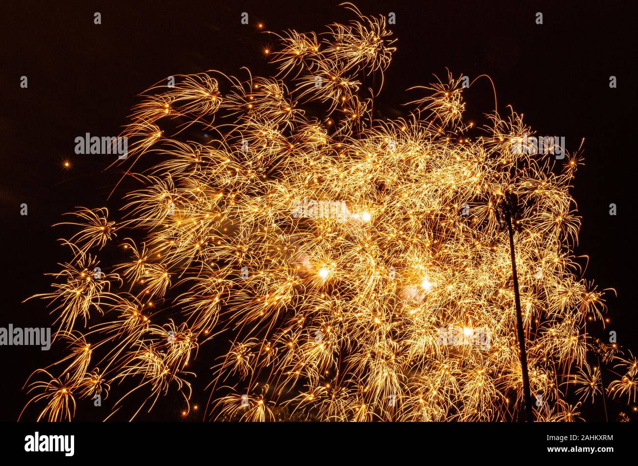 starburst style fireworks display against black sky during fourth of ...