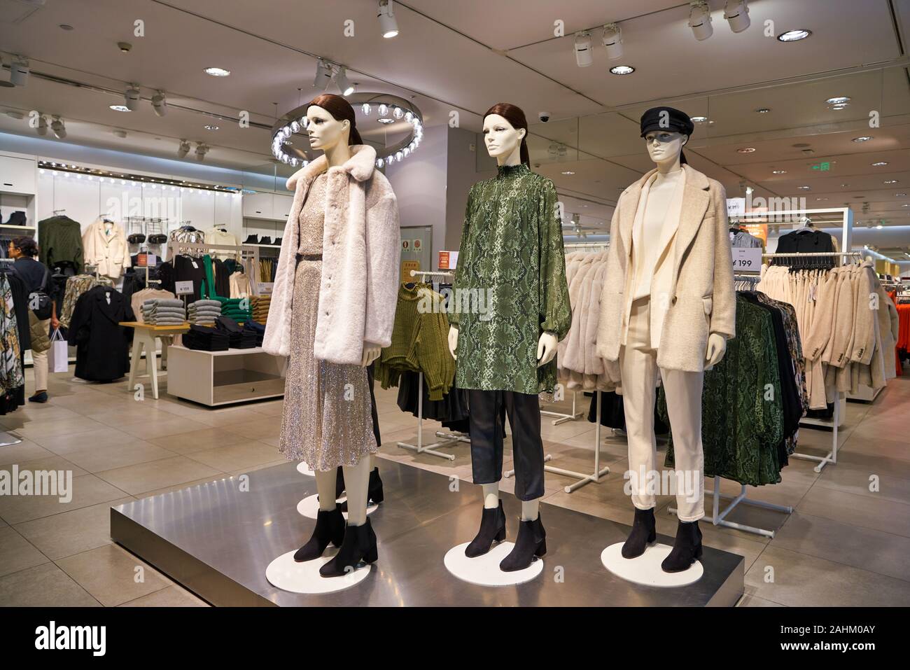 SHENZHEN, CHINA - CIRCA NOVEMBER, 2019: clothing on display in H&M ...