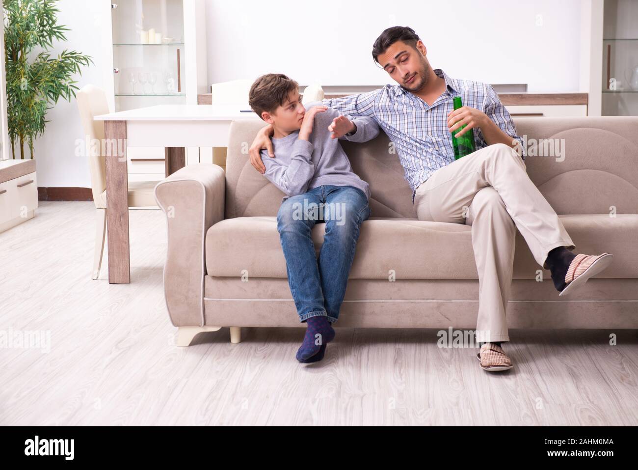 The drunk father and his son Stock Photo - Alamy