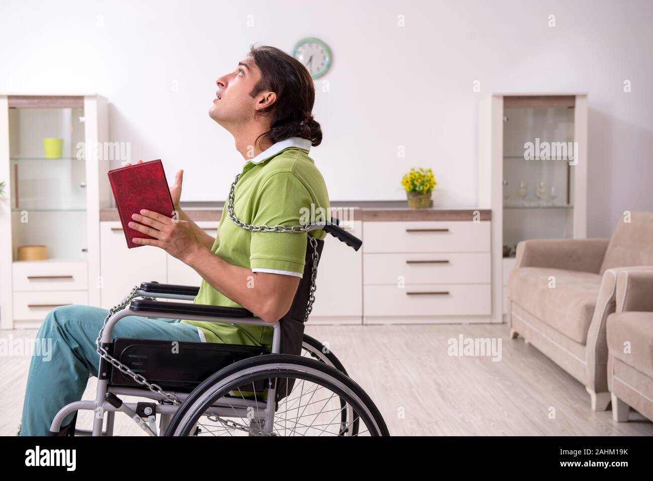 Young disabled male, praying hi-res stock photography and images - Alamy