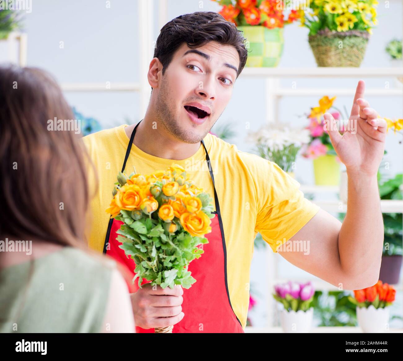 The florist selling flowers in a flower shop Stock Photo - Alamy