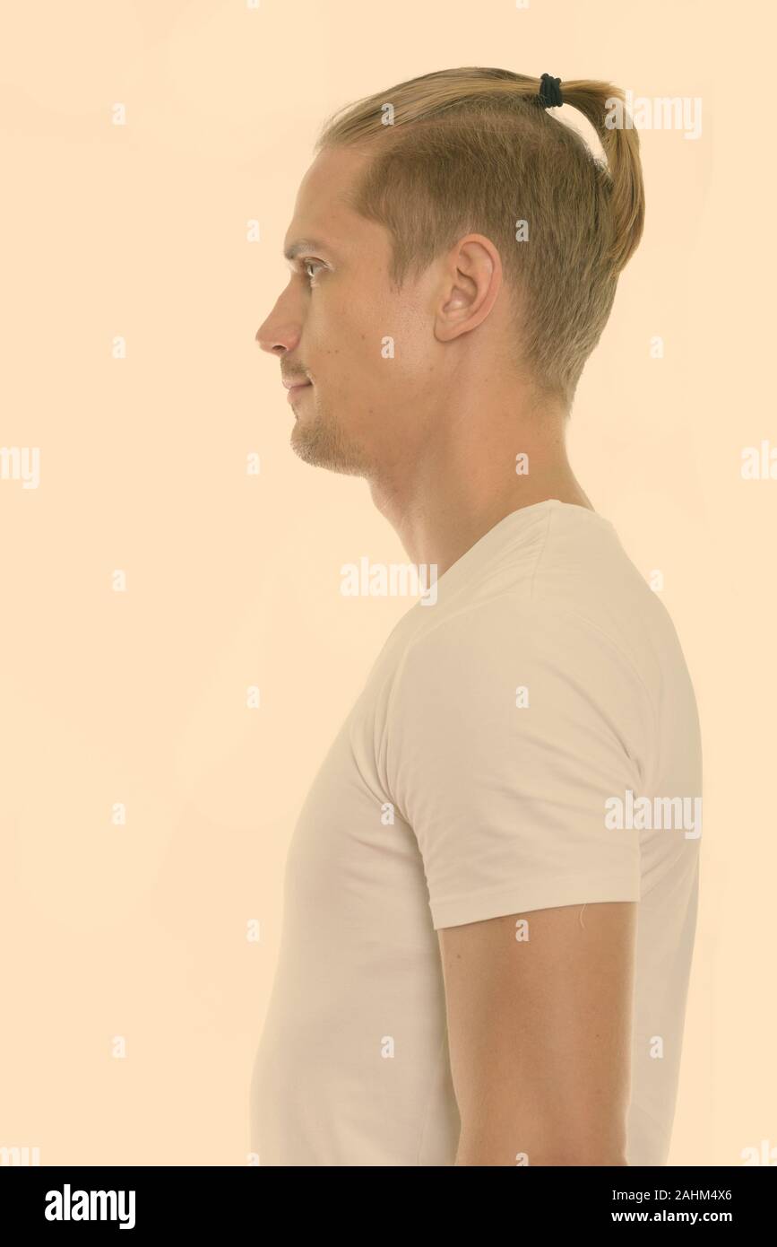 Profile view of young handsome man Stock Photo - Alamy