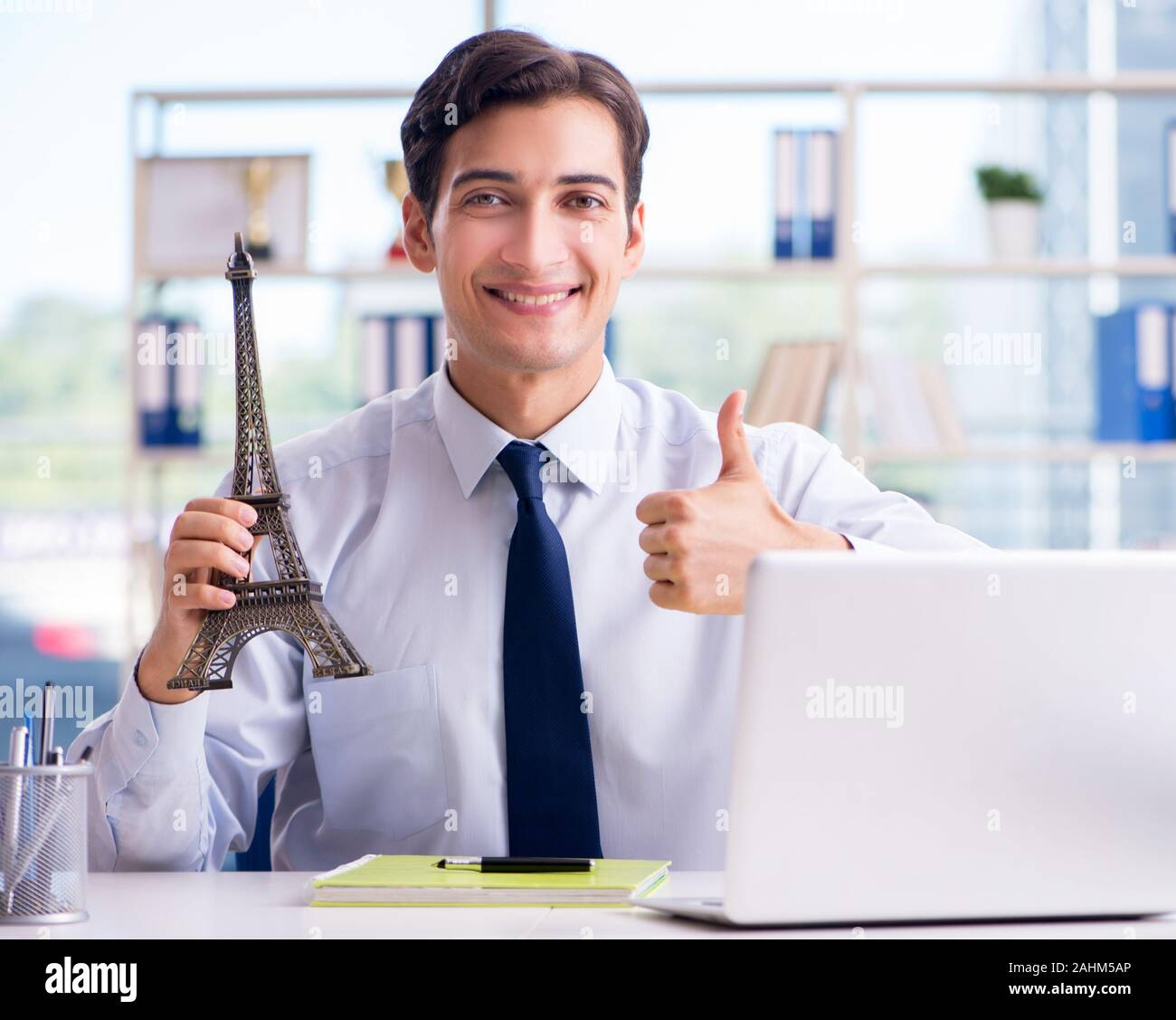 The sales agent working in travel agency Stock Photo - Alamy