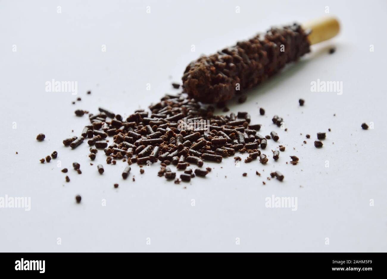 chocolate coated biscuit sticks on white background Stock Photo - Alamy