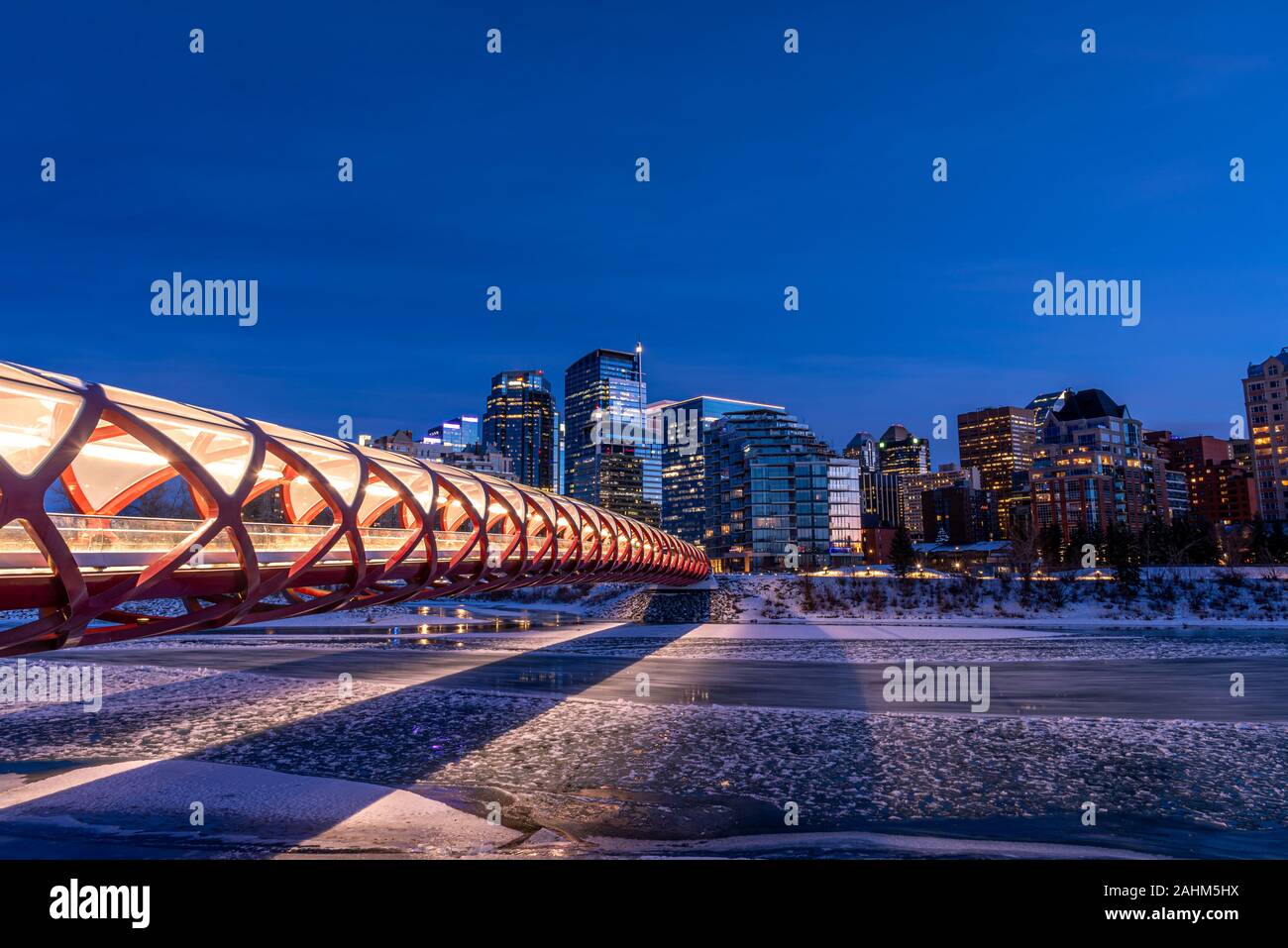 View of Calgary's skyline on a cold winter day. Bow River and the Peace ...