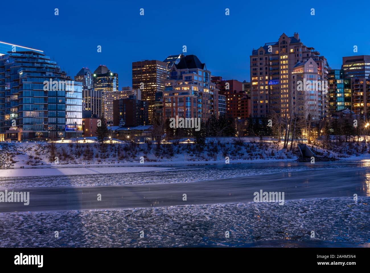 View of Calgary's skyline on a cold winter day. Bow River and the Peace ...