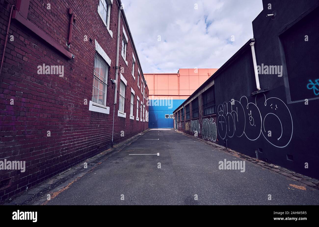 Alley in Melbourne with red brick warehouses, inner city industrial ...