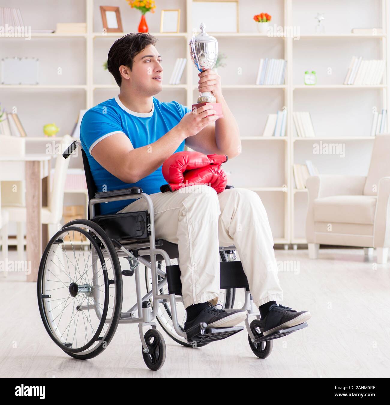 The disabled boxer at wheelchair recovering from injury Stock Photo - Alamy