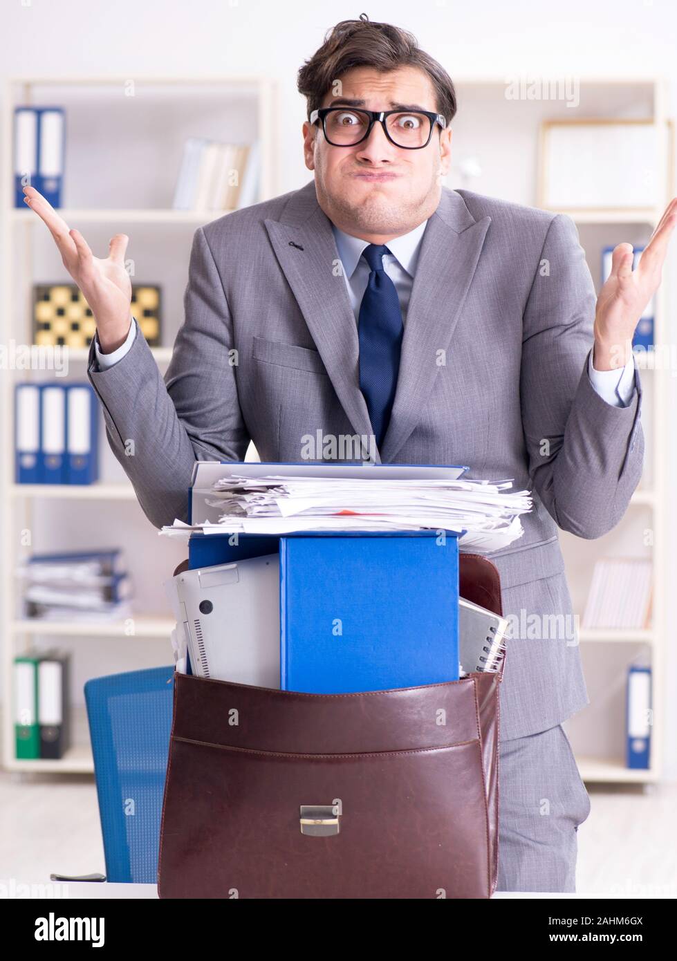 The employee with too much work taking it home Stock Photo - Alamy