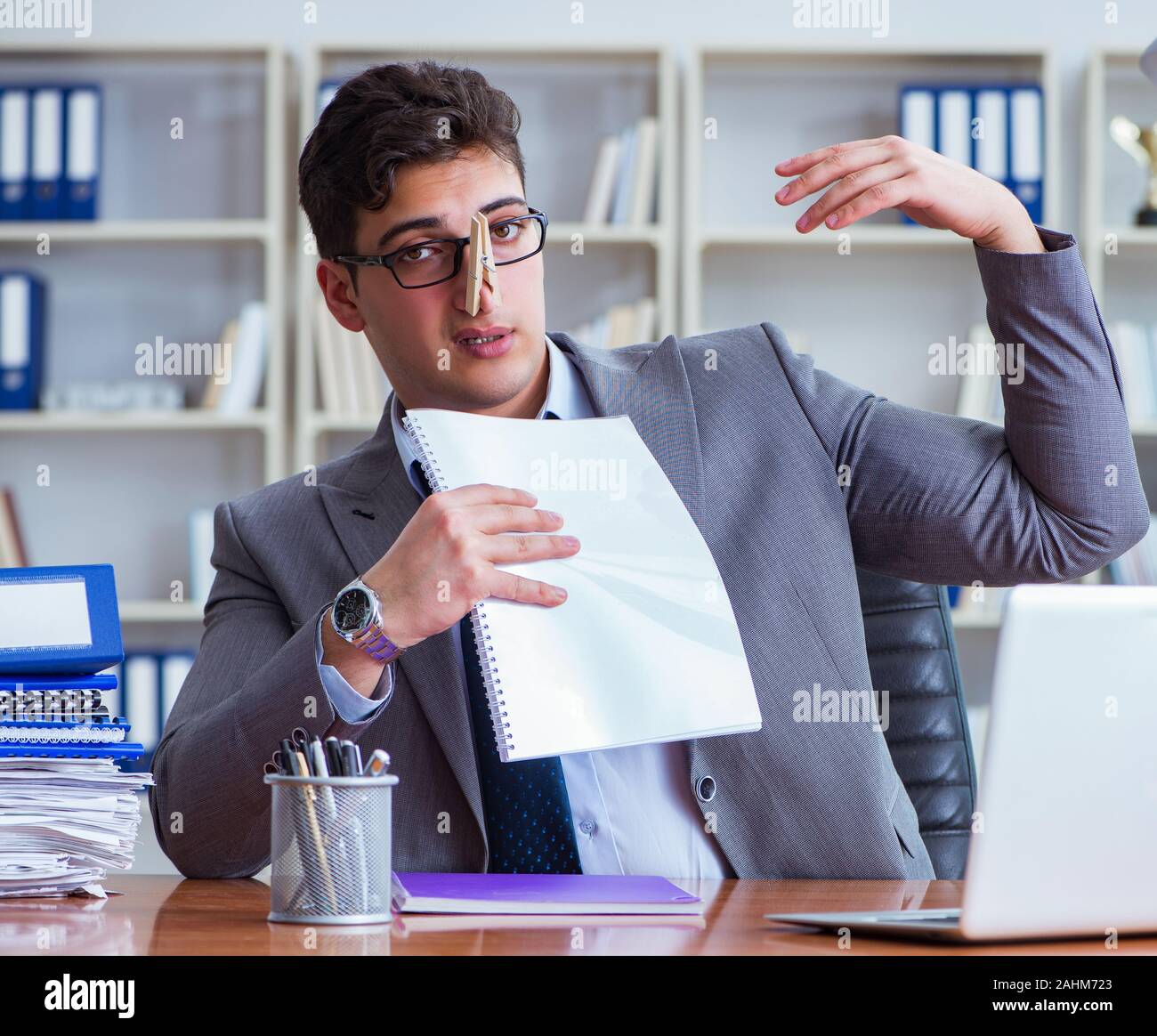 Businessman sweating excessively smelling bad in office at workplace ...