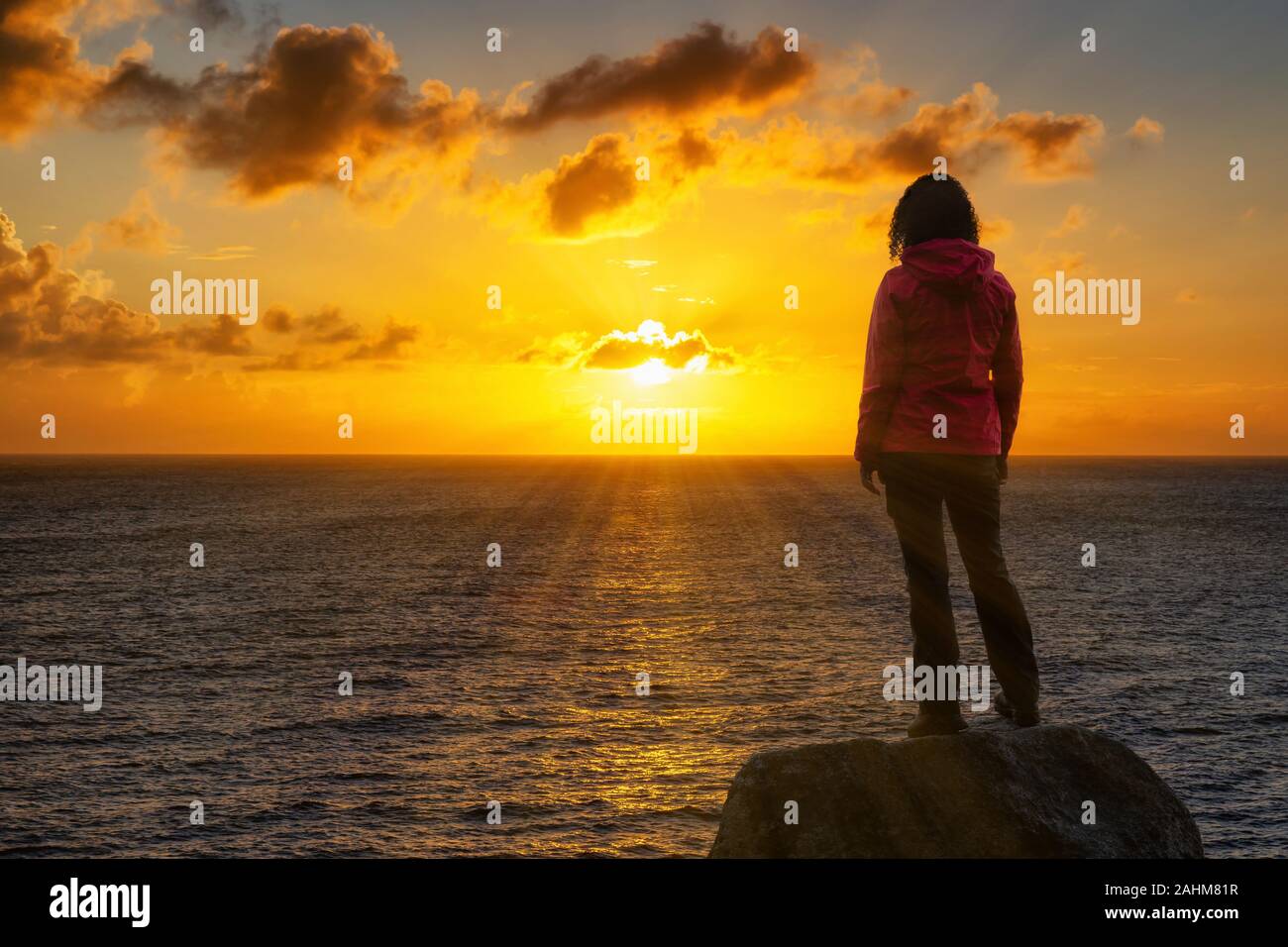 Adventurous Girl on a Rocky Ocean Coast Stock Photo - Alamy