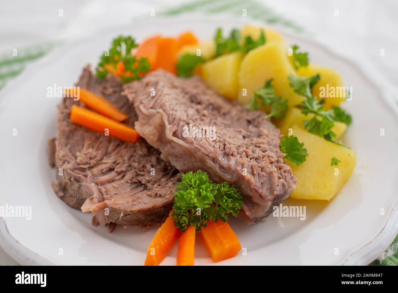 Prime boiled beef with root vegetables, Viennese Tafelspitz Stock Photo ...