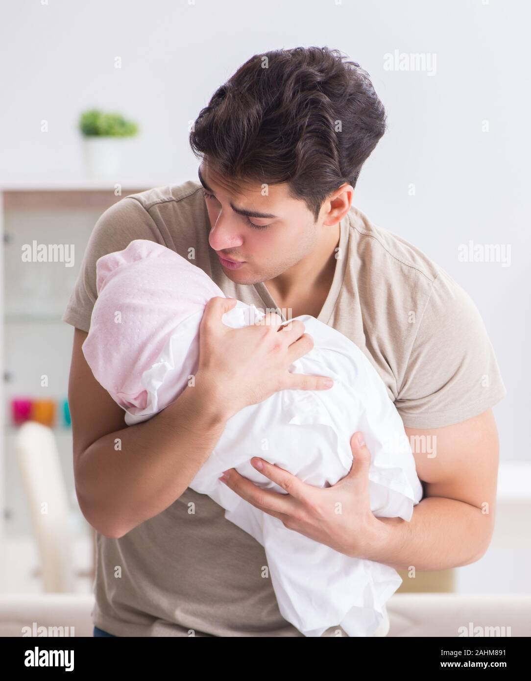 Young father dad frustrated at crying baby Stock Photo - Alamy