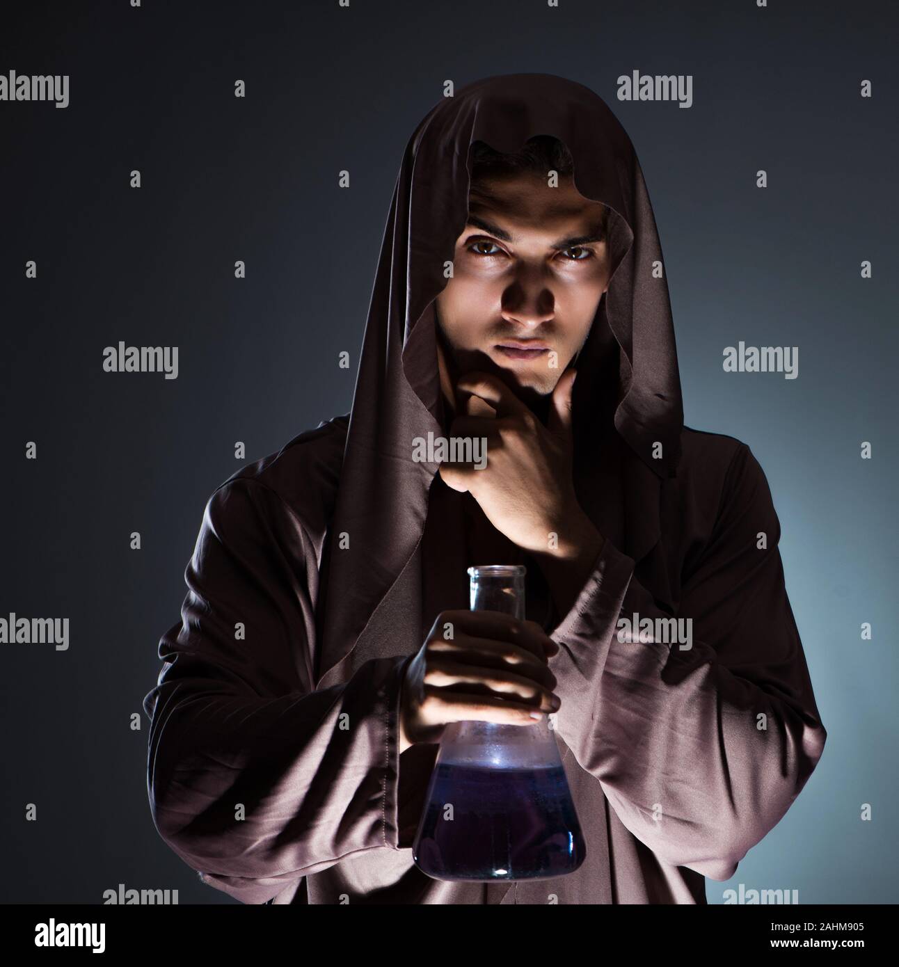 The alchemist doing experiments in alchemy concept Stock Photo - Alamy