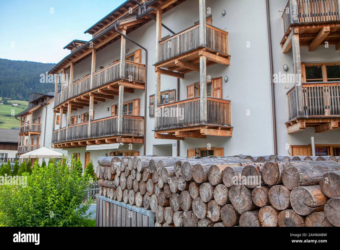 Heap of wooden logs, hotel in rural area Stock Photo - Alamy