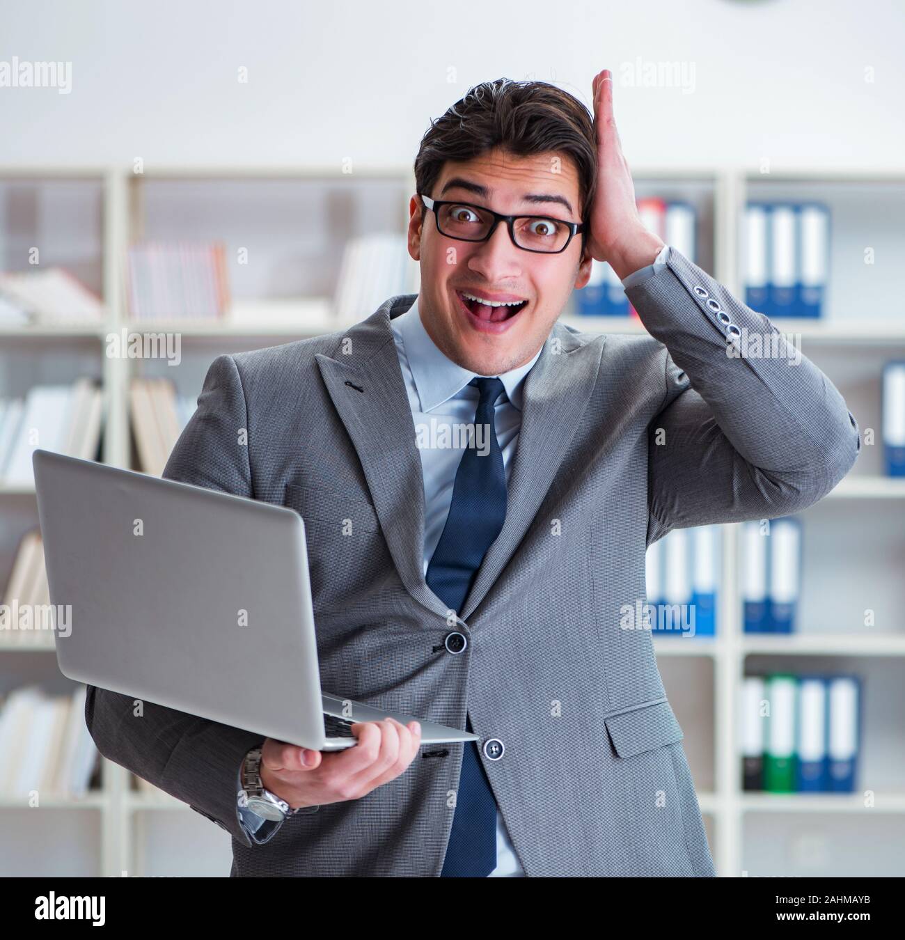 The businessman in the office working with laptop Stock Photo - Alamy
