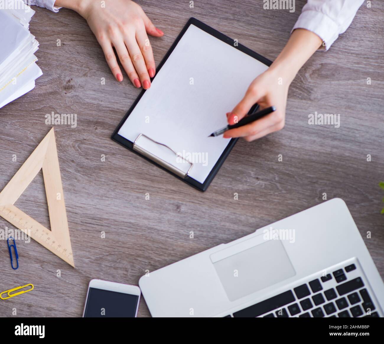 The top view of working desk with hands Stock Photo - Alamy