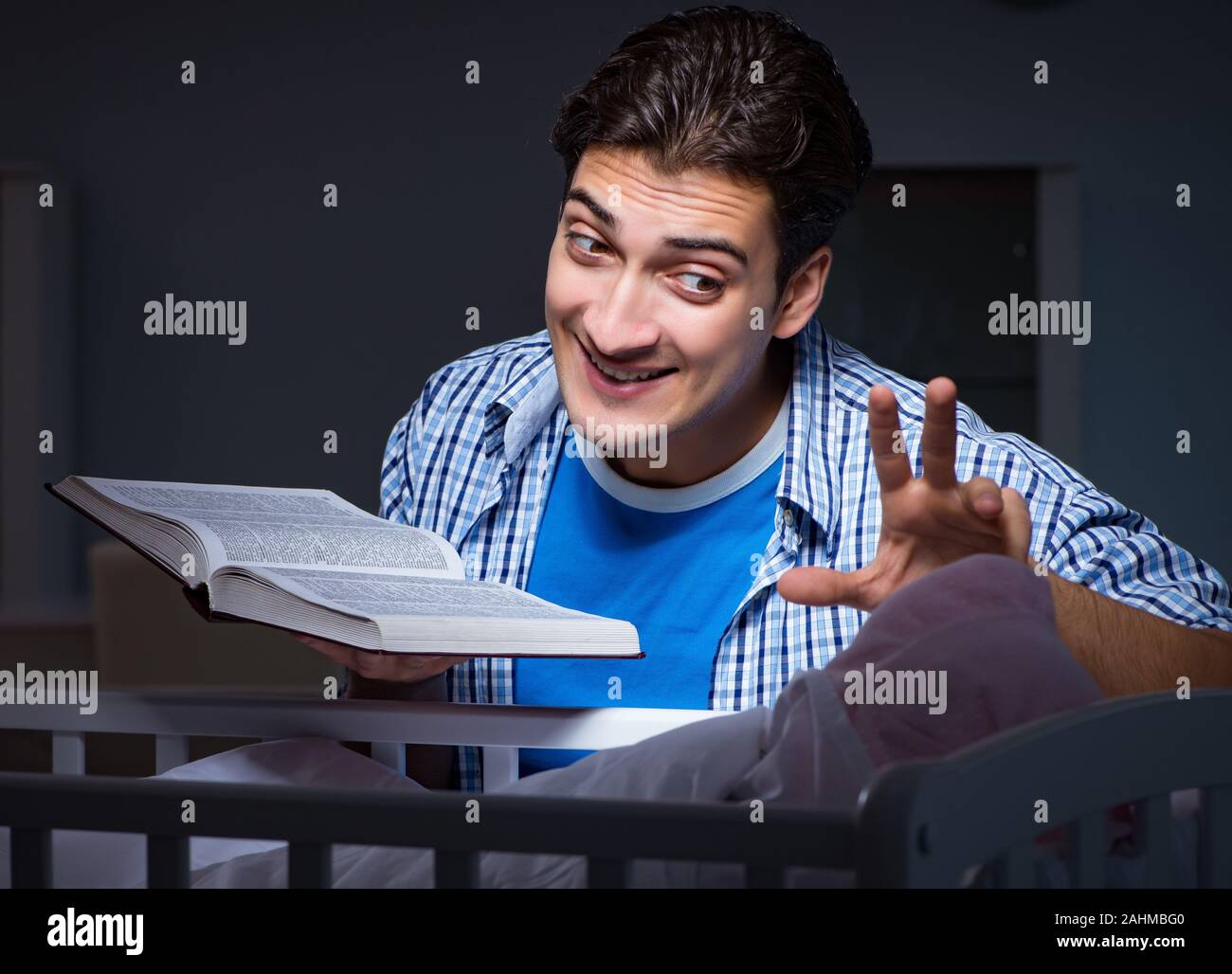 The young student doing homework and looking after newborn baby Stock ...