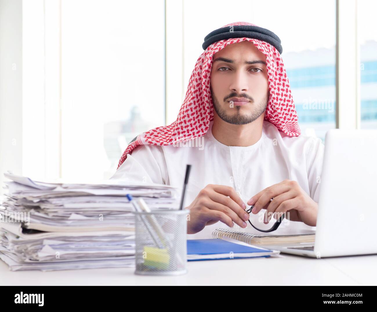 The arab businessman working in the office Stock Photo - Alamy