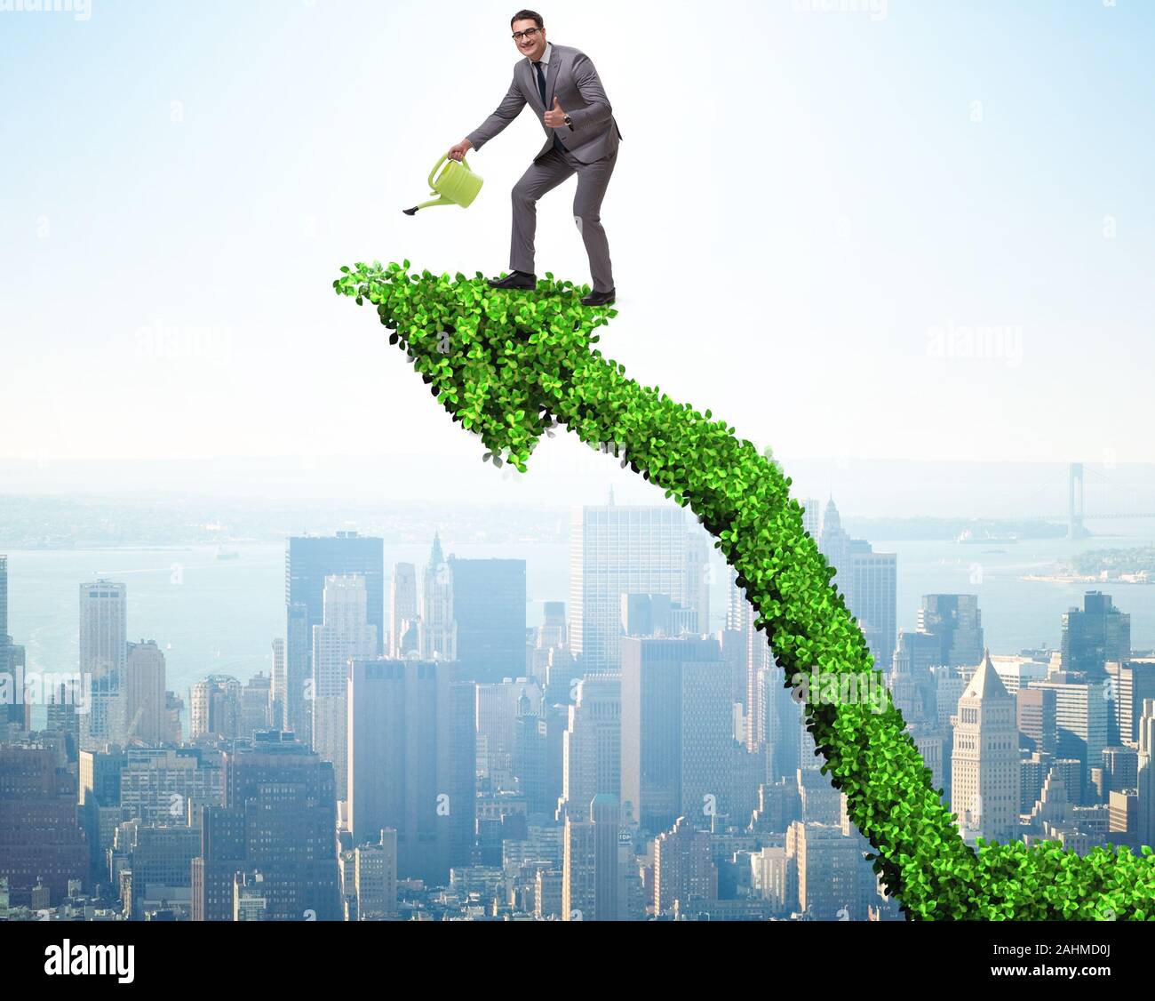 The businessman in investment concept watering financial line chart ...