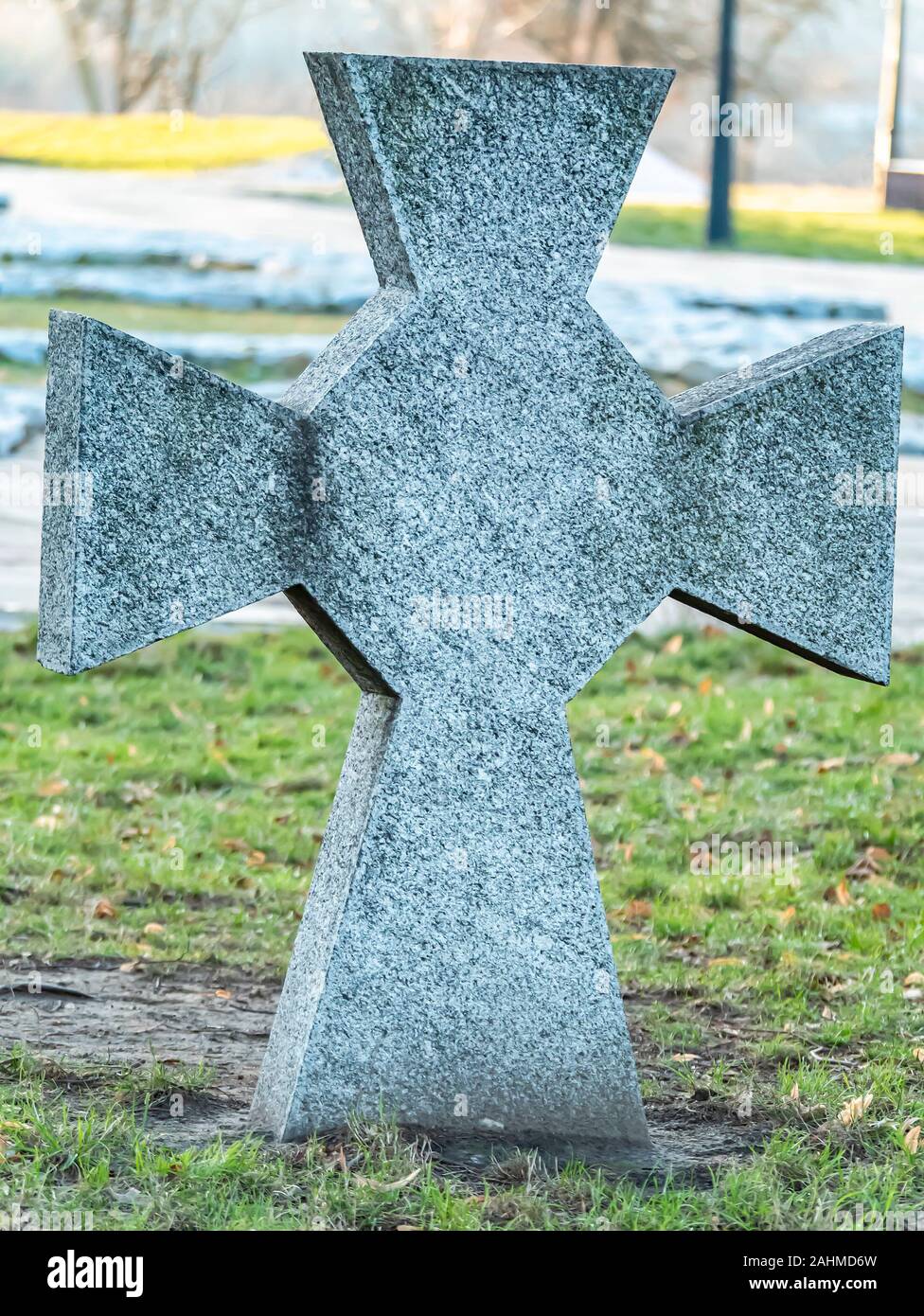 Granite orthodox cross on the earth. Religion. The grave. Cemetery ...