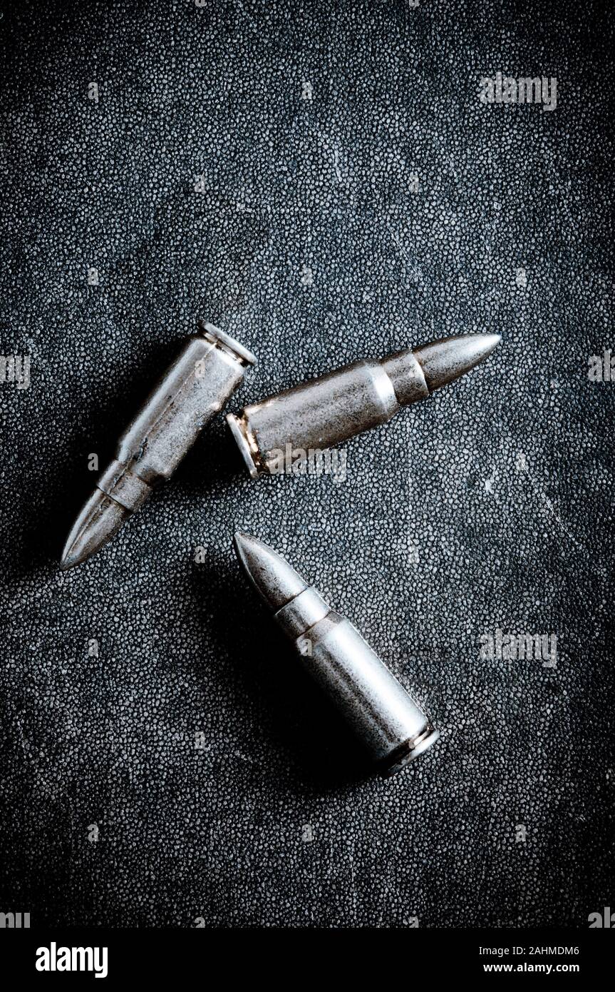 three ammunition for Kalashnikov or bullets Stock Photo - Alamy