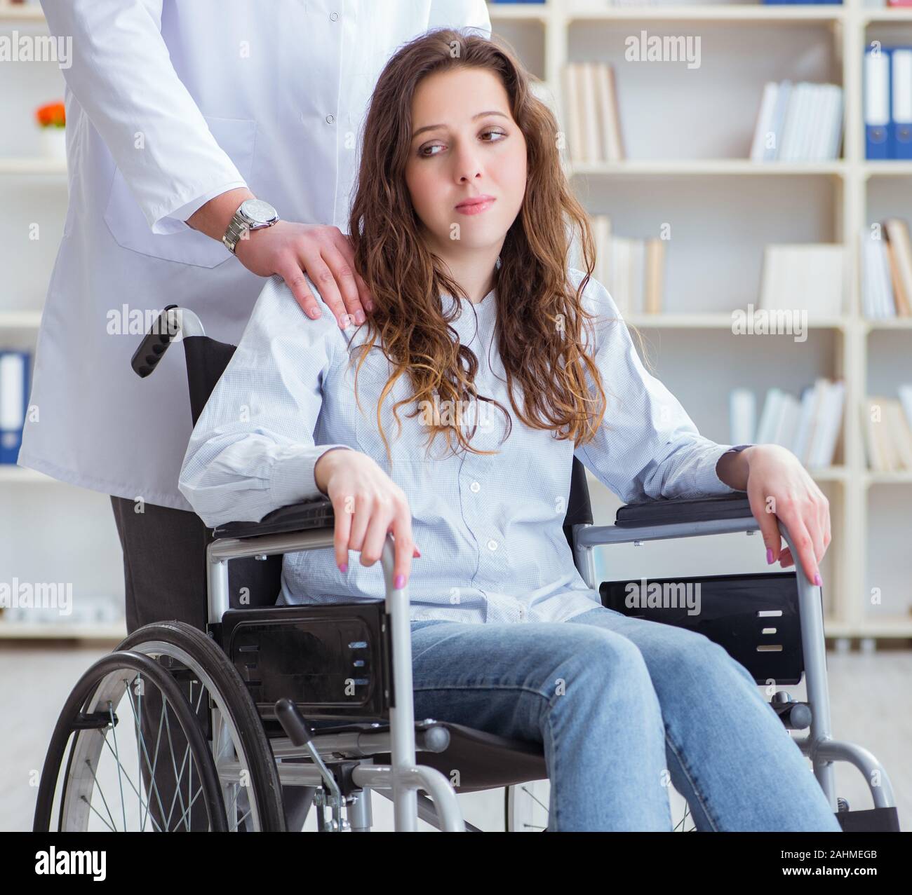 Disabled patient on wheelchair visiting doctor for regular check up ...