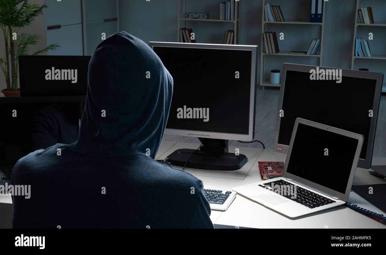 The hacker hacking computer at night Stock Photo - Alamy