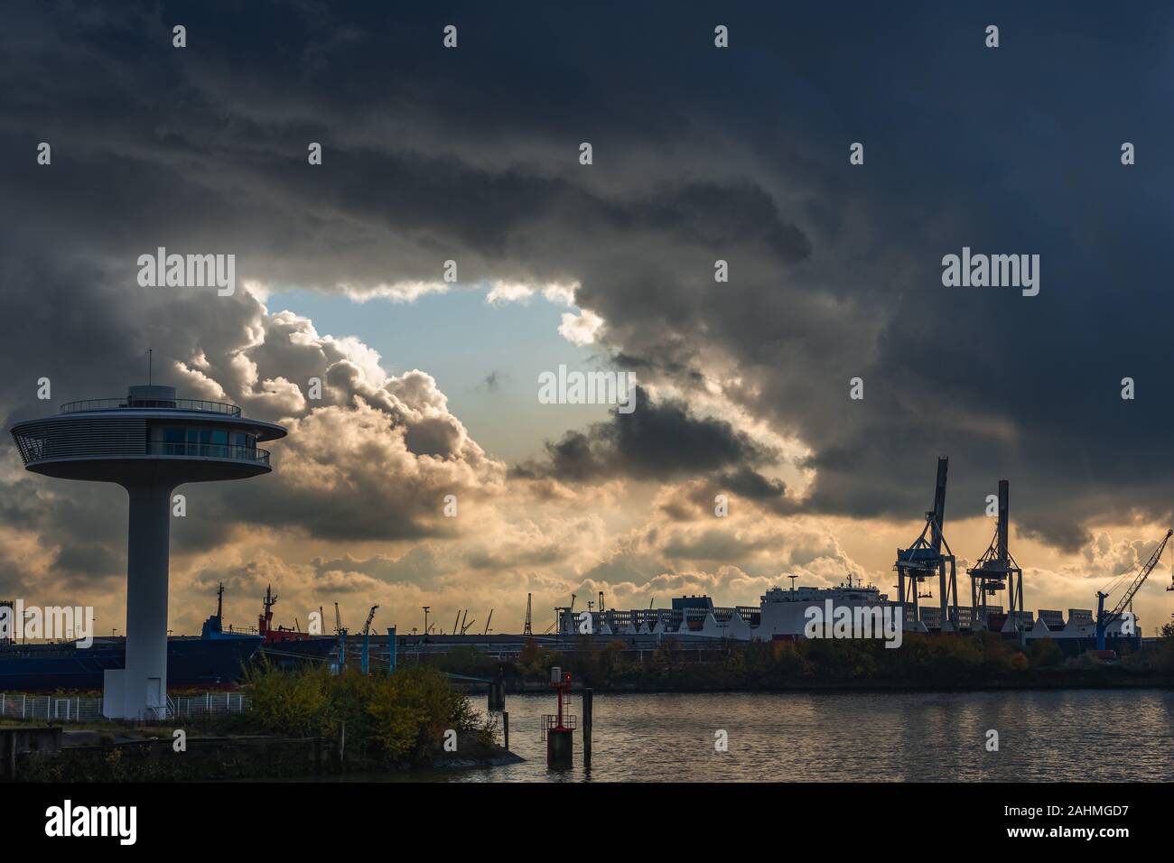 Lighthouse zero in Port of Hamburg Hafencity with stormy clouds in the ...