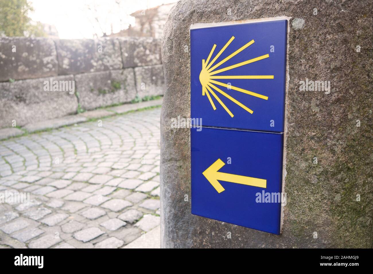 Way of St. James sign. Yellow scallop sign pilgrimage to Santiago de ...