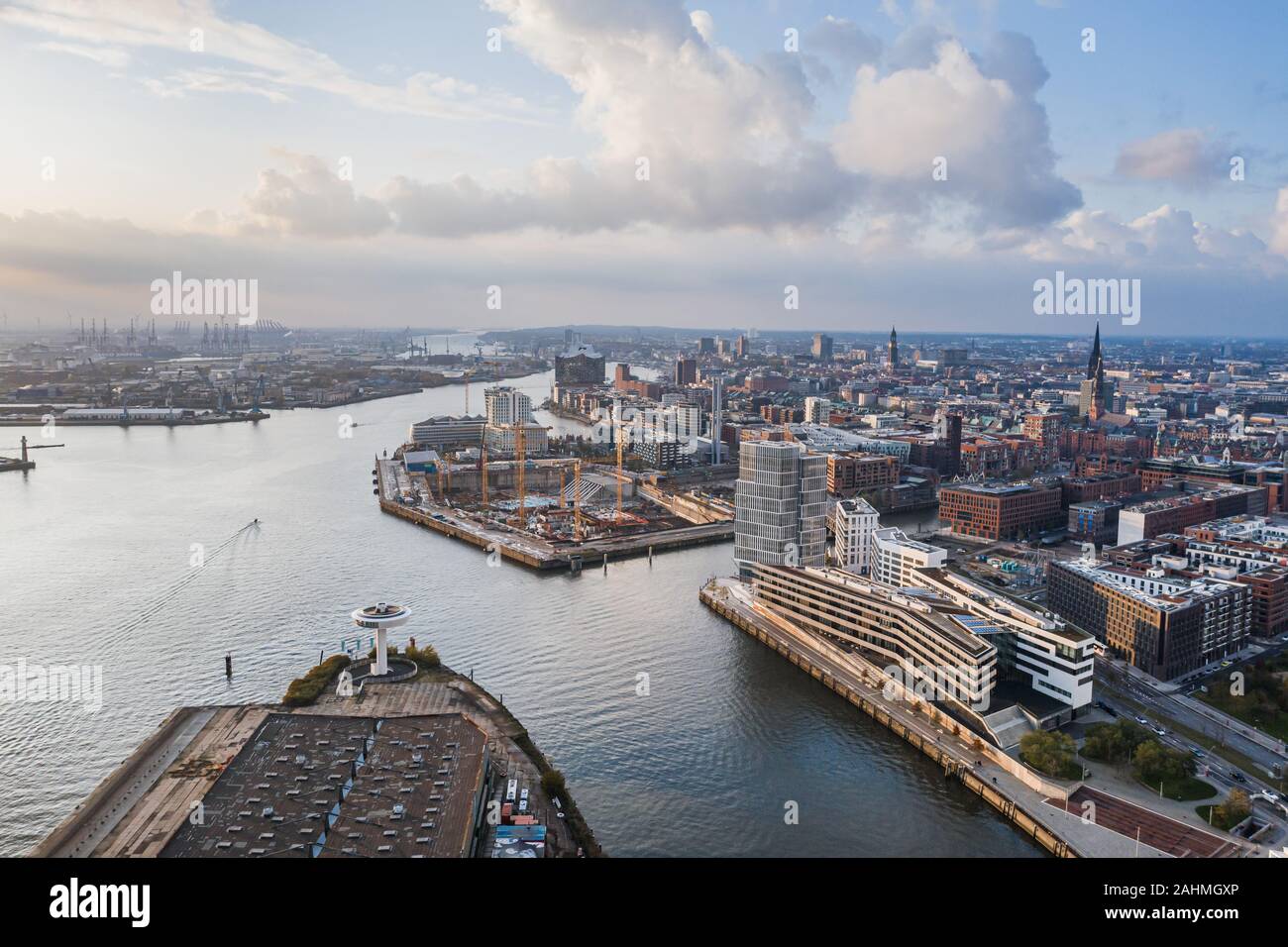 Aerial drone view of Port of Hamburg with clouds over historical city ...