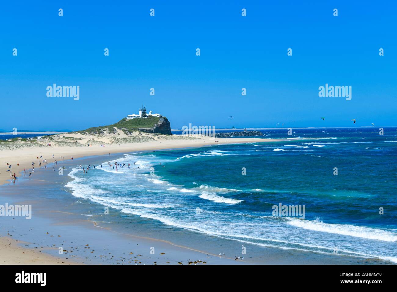 View of Nobbys Head and Beach with People Swimming in Blue Ocean on ...