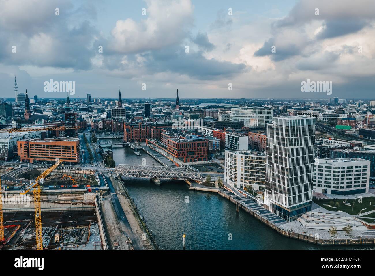 Aerial drone view of Port of Hamburg with clouds over historical city ...
