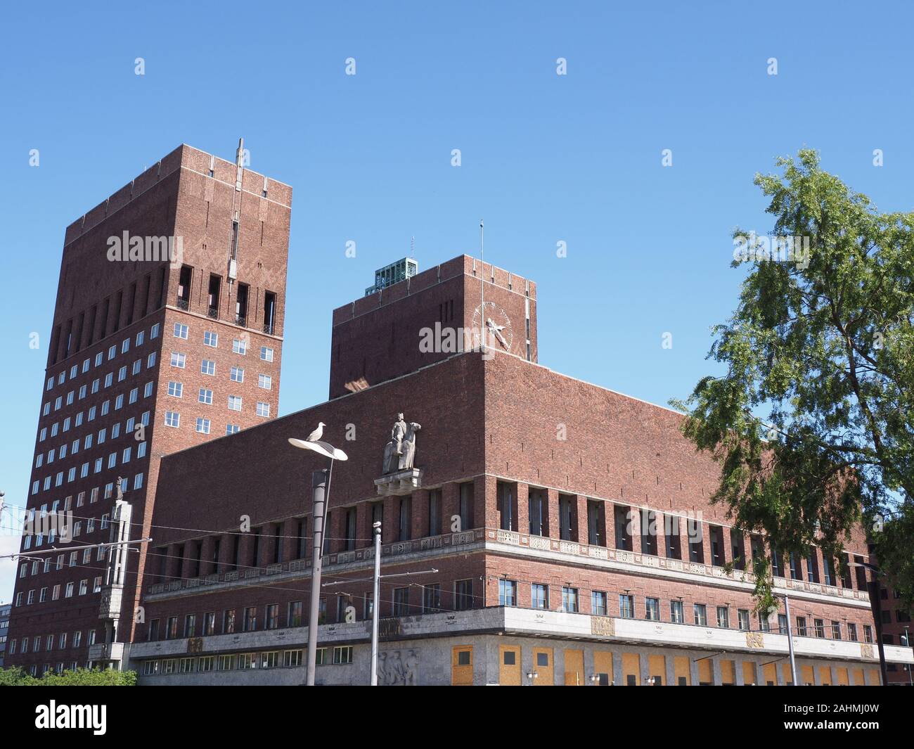 City hall building and tree on main square in european capital city of ...