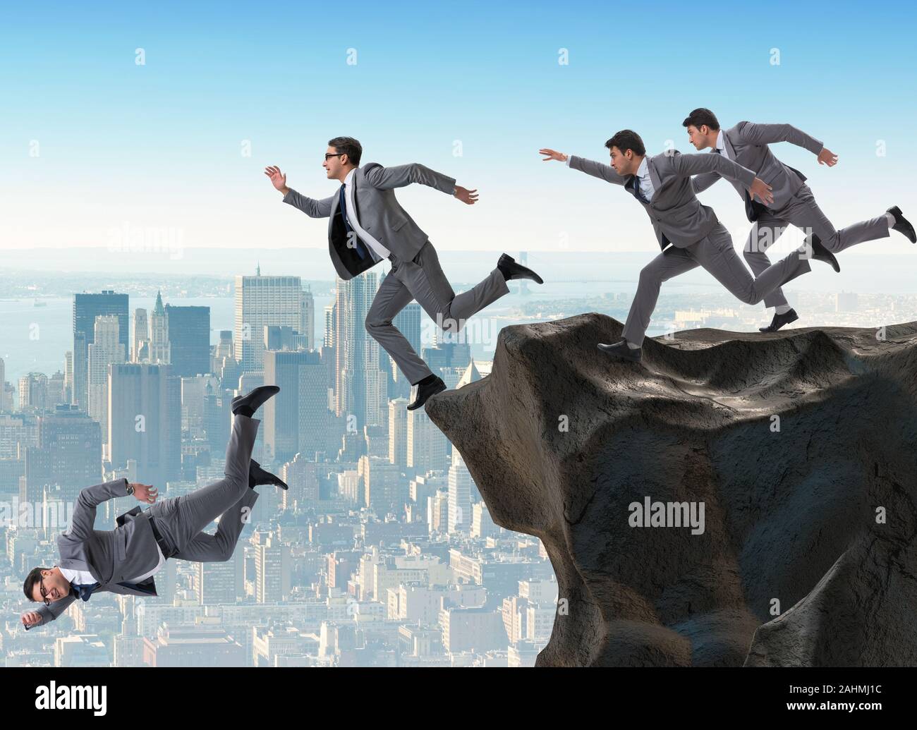 The business people falling off the cliff Stock Photo - Alamy